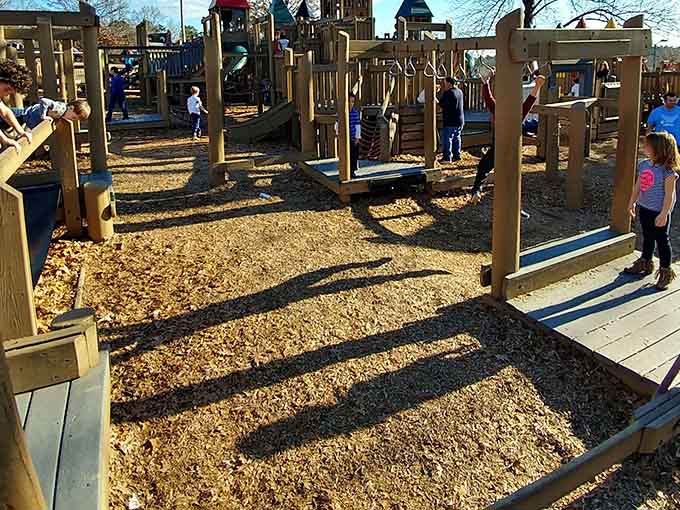 Balance beams and wooden obstacles create natural challenges that keep kids engaged without them realizing they're building important motor skills.