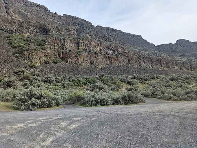 The parking area sits right at the base of those towering cliffs, making this adventure wonderfully accessible.