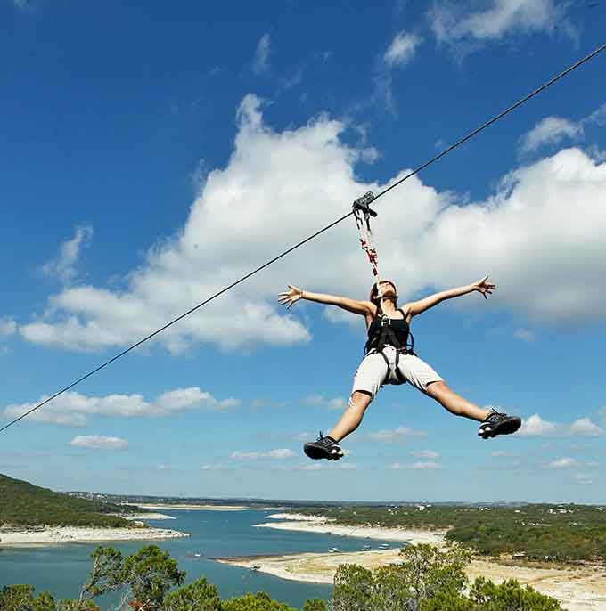 Arms spread wide, embracing the sky and the kind of freedom that makes you feel invincible and wonderfully alive.