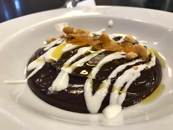 Chocolate budino drizzled with cream and olive oil. Silky Italian comfort that ends meals on high notes.