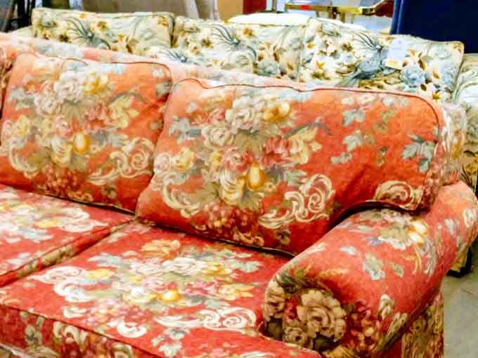 This floral couch has more personality than most people's entire living rooms and probably better stories to tell.
