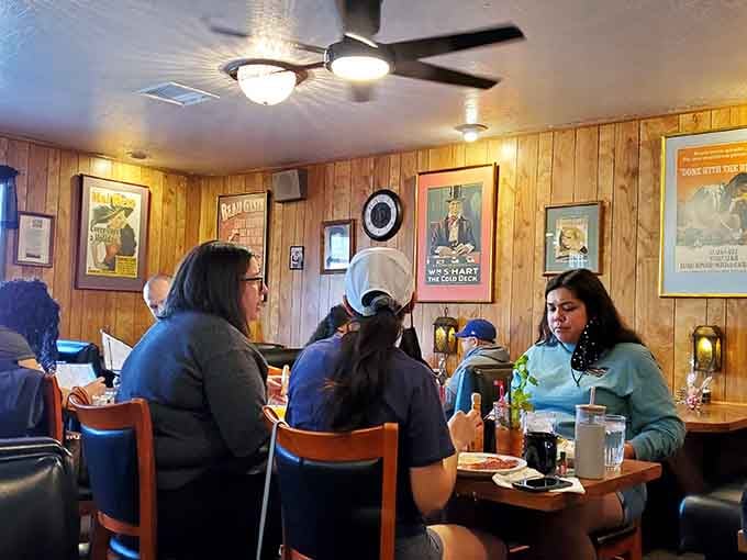 Happy diners enjoying their meals in cozy surroundings prove that great barbecue creates instant community everywhere.