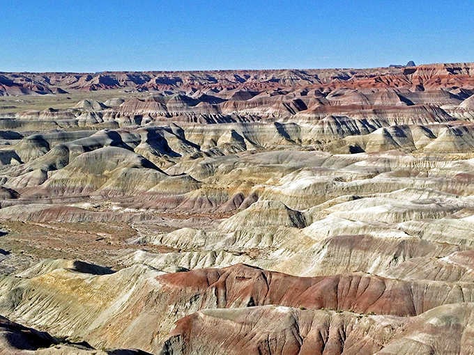 Layers of cream, rust, and gray stack up like a geological parfait that took 225 million years to prepare.