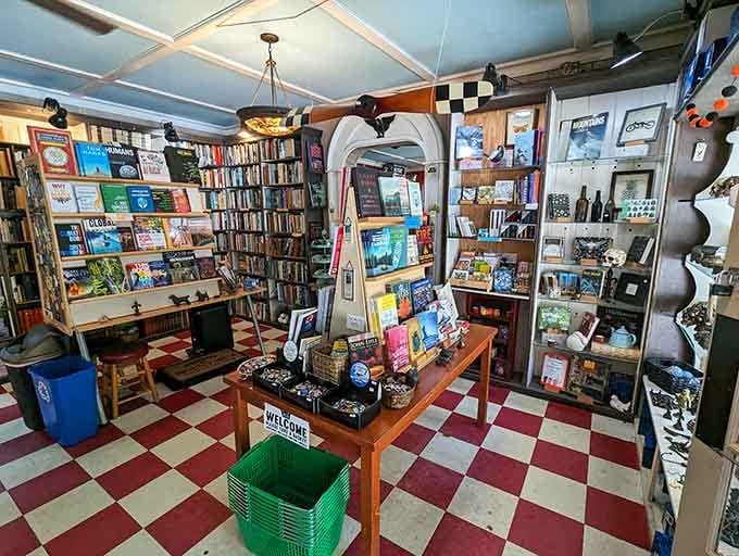 Wooden floors and packed shelves create an atmosphere where time slows down and pages turn themselves naturally.