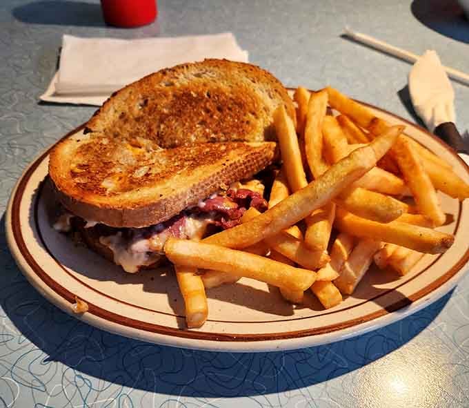 The patty melt with fries is proof that sometimes the simplest combinations create the most profound joy.