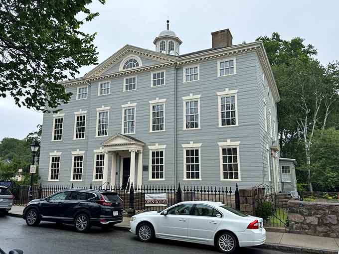 The Jeremiah Lee Mansion rises in Georgian splendor, three stories of colonial wealth and impeccable taste.