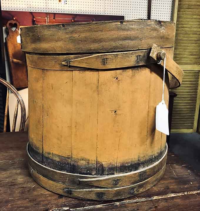 This antique wooden firkin bucket has seen more history than most textbooks and looks better doing it.