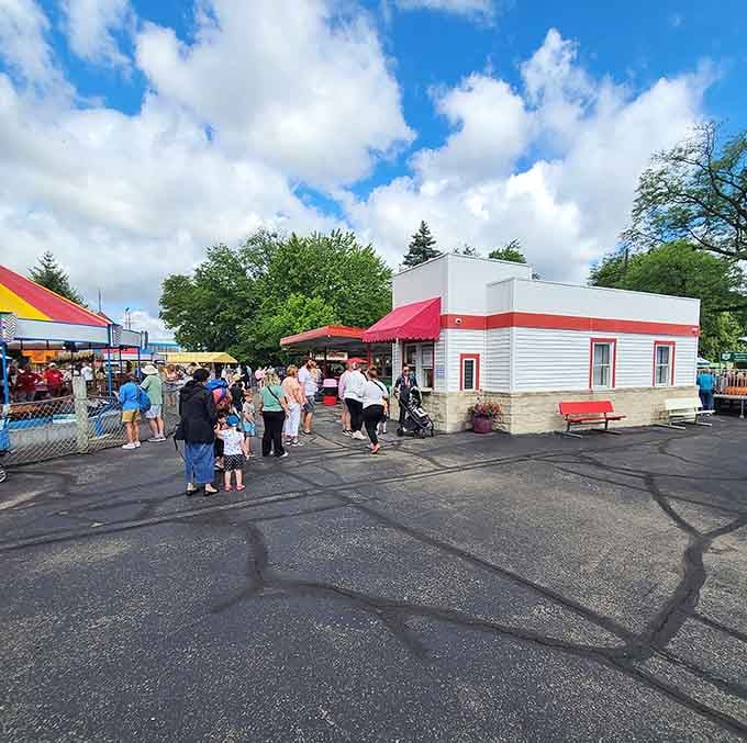 That crowd gathering near the classic snack bar shows this place still draws families like it did in Eisenhower's day.