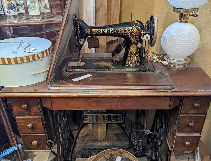 An antique Singer sewing machine that's built better than most modern appliances, fight me on this.