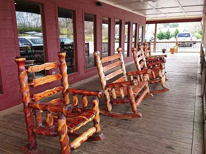 Rustic log chairs on the porch offer the perfect spot to contemplate your upcoming food coma.