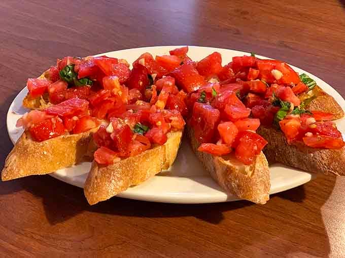 Fresh tomatoes and basil on toasted bread prove that sometimes the simplest things are absolutely the most satisfying.