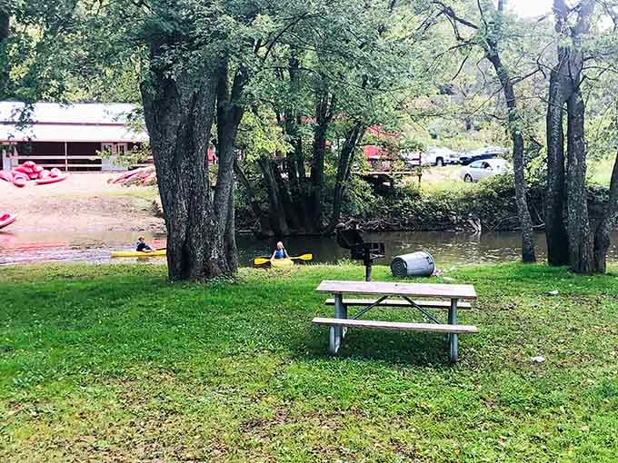 A picnic table by the river where you can rest and contemplate your excellent life choices.