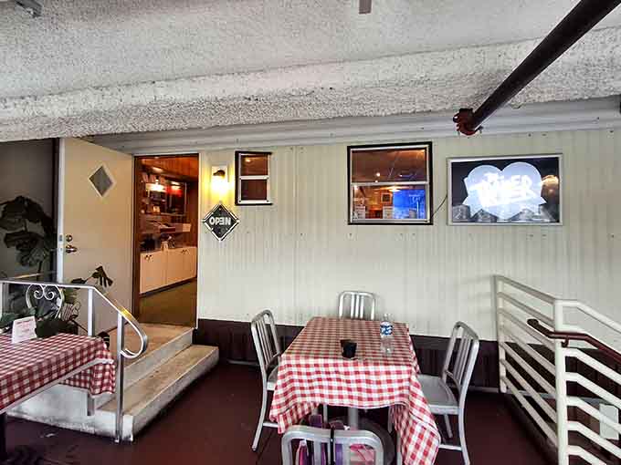 The checkered tablecloths and metal chairs create a vibe that's part Italian grandmother's kitchen, part Detroit cool.