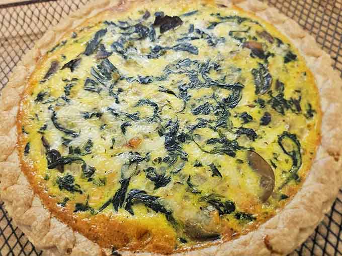 Spinach quiche in a flaky crust that looks like it came from someone's beloved grandmother's kitchen.
