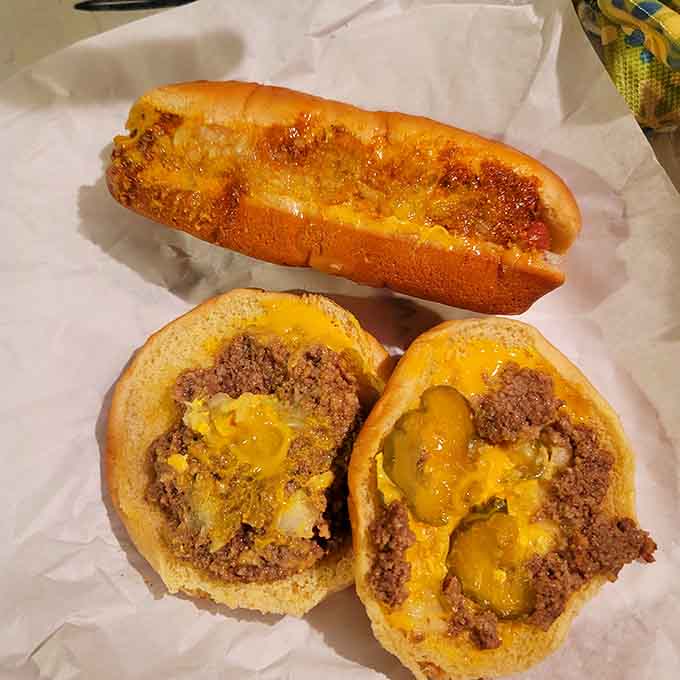 A cheese dog joins two chili-laden beauties, creating a trio that would make any diner patron from 1955 proud.