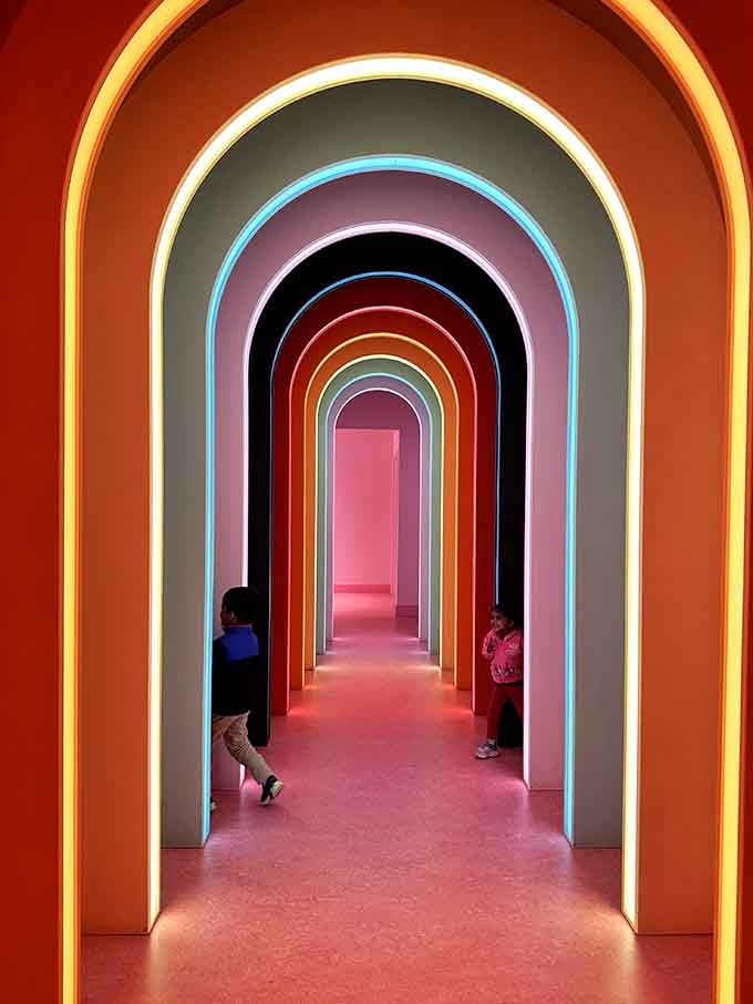 Walking through this rainbow tunnel feels like stepping inside a Skittles commercial, minus the talking fruit.