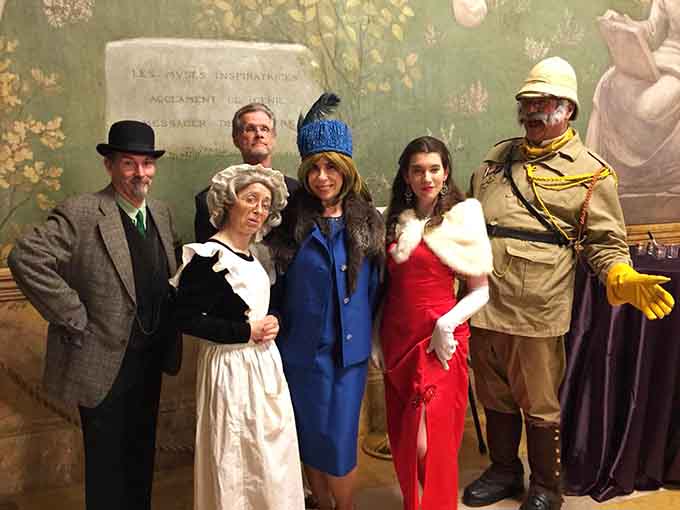 The lineup of suspects looking appropriately guilty, innocent, and dramatically costumed for maximum intrigue and entertainment value.