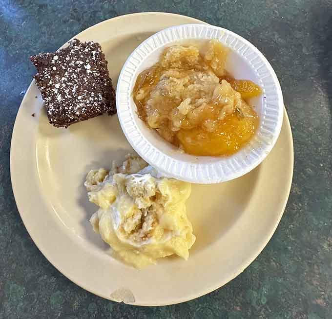 Peach cobbler and brownies sitting together like old friends who both know how to make you smile after dinner.