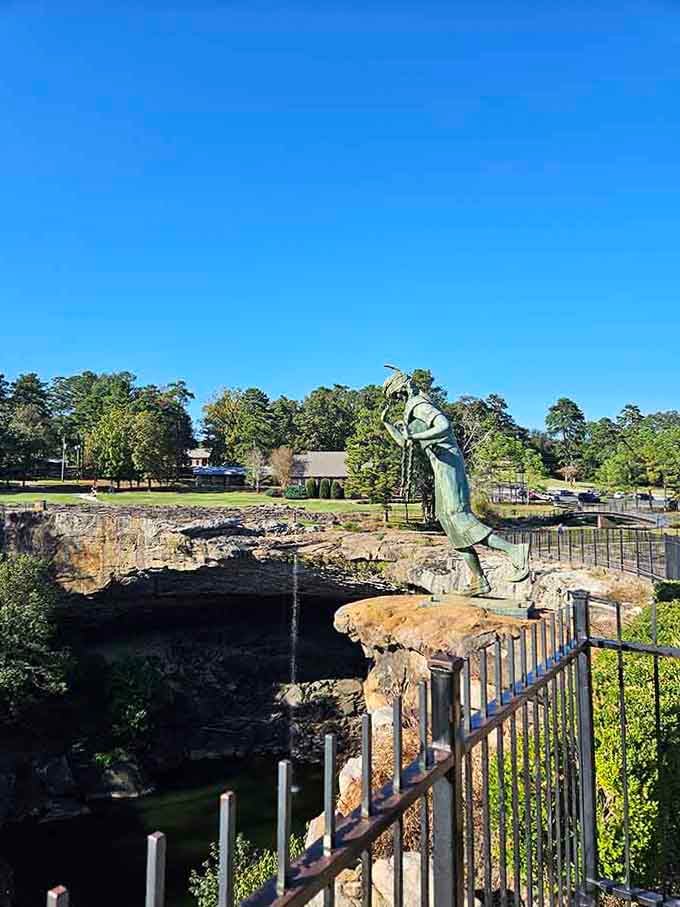 The statue overlooks the falls with the kind of dramatic flair that would make any soap opera jealous.