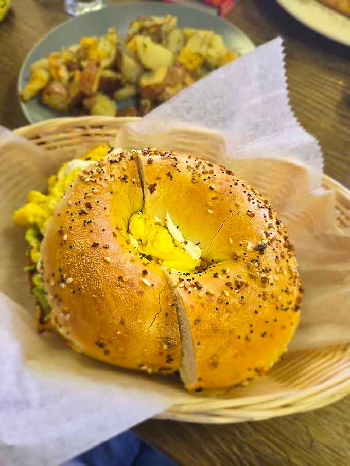 That toasted bagel loaded with eggs proves that sometimes the simplest combinations are the most brilliant ones.