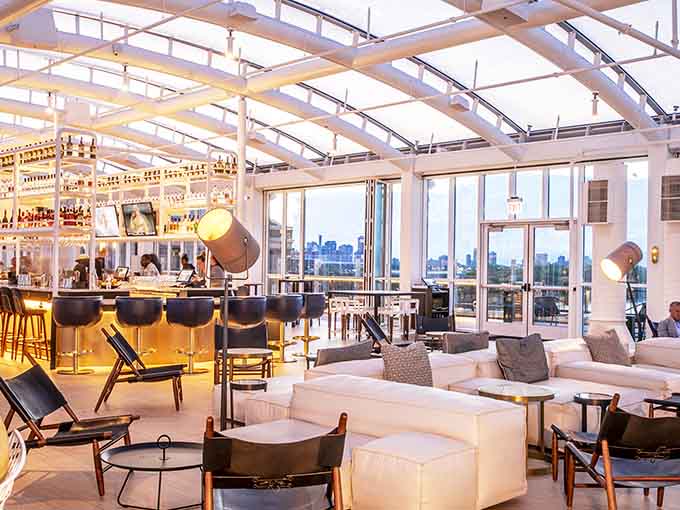 Modern lounge seating meets panoramic lake views in this bright, airy space that somehow feels both fancy and welcoming.