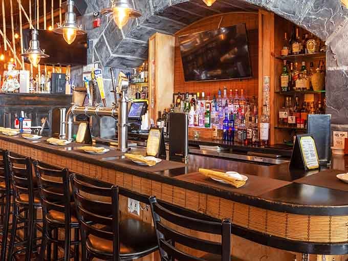 The curved bar invites you to pull up a stool and watch skilled chefs transform raw ingredients into edible masterpieces.