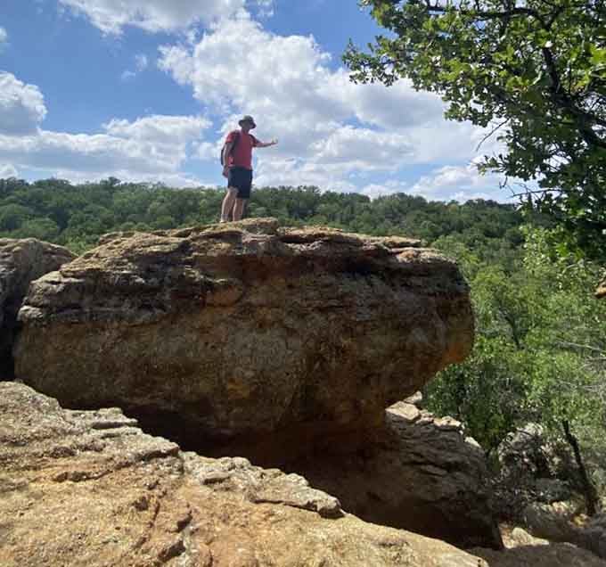 Standing atop ancient rock formations like you're auditioning for a nature documentary&mdash;Instagram gold, basically.