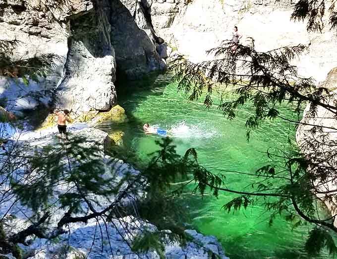 Swimming in water so clear it feels like floating through liquid sapphire with a mountain view bonus.
