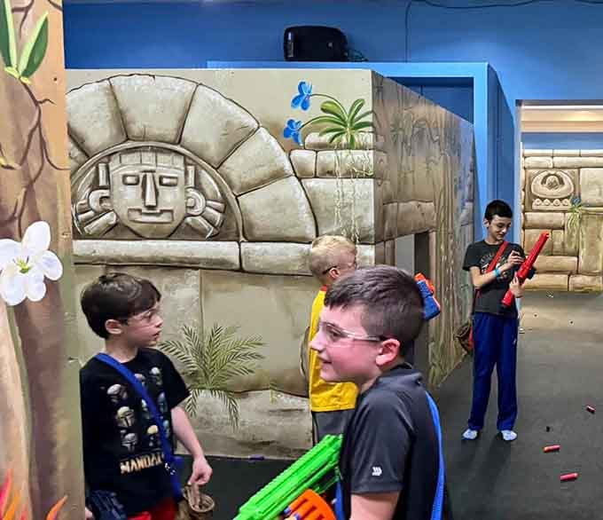 Stone temple facades and bamboo accents transform the space into an adventure zone, proving that themed environments make everything exponentially more exciting.