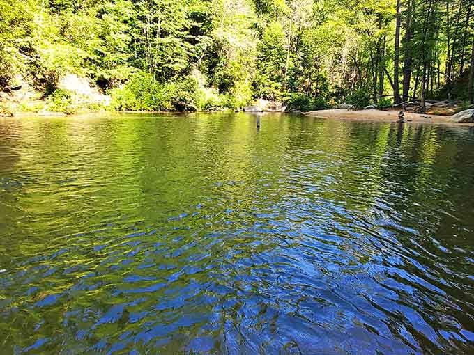 This swimming hole stays calm and inviting even when the falls are roaring nearby.