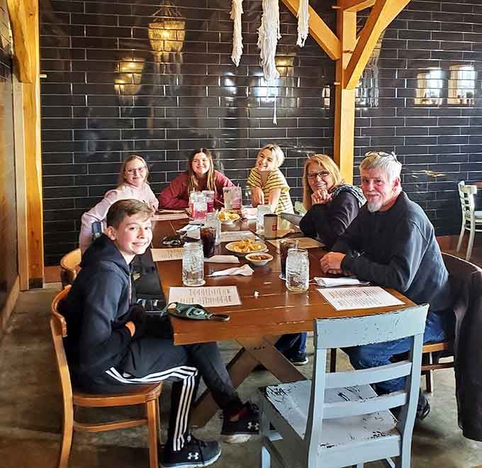 Happy diners gathered around the table show that great food brings families together across all cultures.
