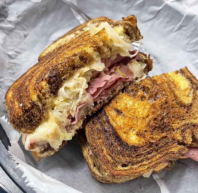 The Reuben gets grilled to golden perfection, proving that some sandwiches are worth the inevitable napkin shortage.