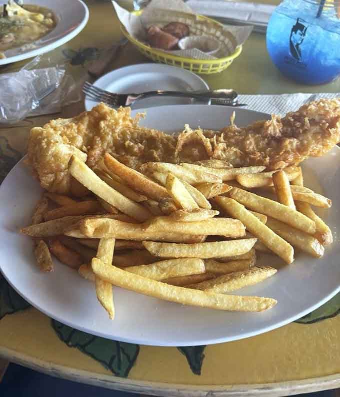 Fish and chips piled high enough to make you reconsider your life choices, in the best way.