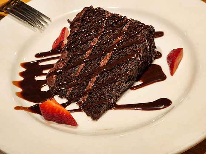 Chocolate cake so decadent it deserves its own flight plan, with layers that would make any dessert lover weep with joy.