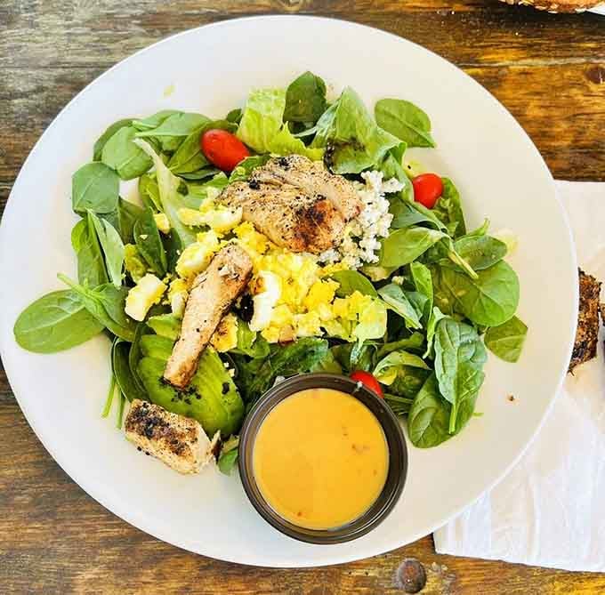 A salad substantial enough to satisfy, proving this tavern respects all appetites, even the virtuous ones.