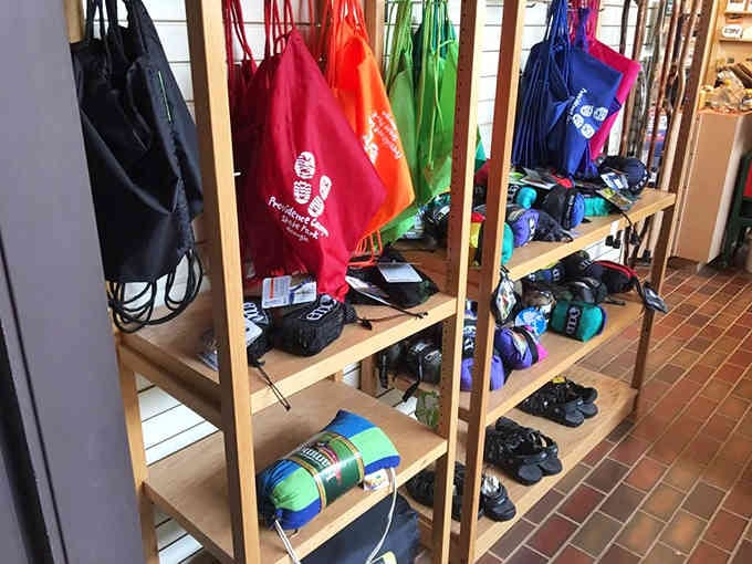 Colorful backpacks and hiking gear line the shelves, ready to equip adventurers for their canyon exploration journey ahead.