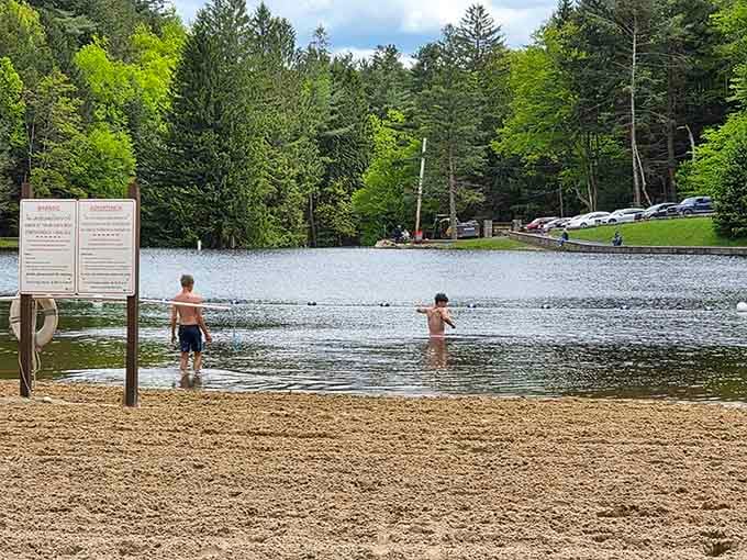 Kids brave the refreshing lake water while parents watch from shore, grateful for lifeguards and that second cup of coffee.