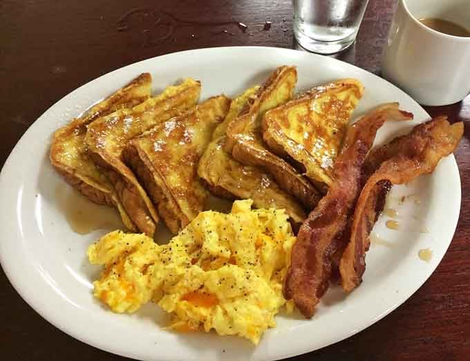 French toast golden enough to make King Midas jealous, paired with bacon that's cooked to crispy perfection.