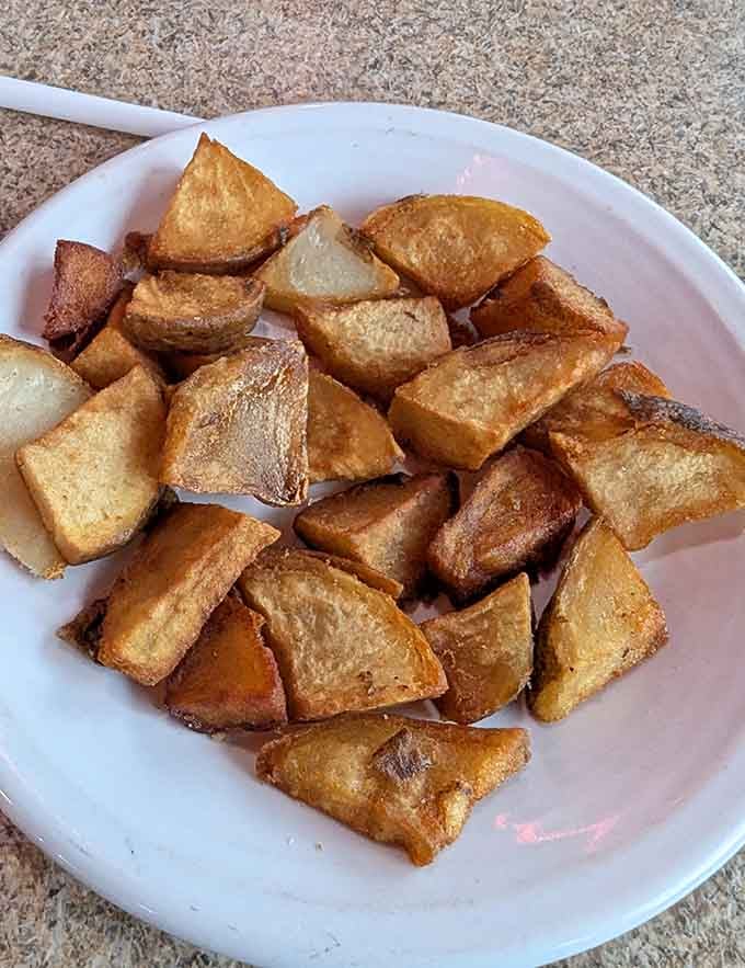 Breakfast potatoes done right: golden, crispy cubes that prove simple ingredients plus proper technique equals pure magic.