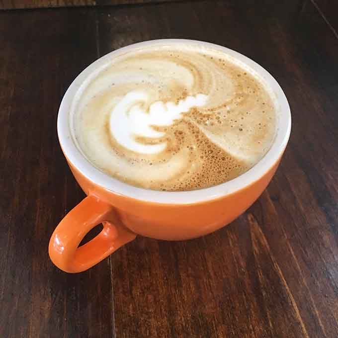 Perfectly poured latte art proves the coffee game here is as strong as the ice cream selection itself.