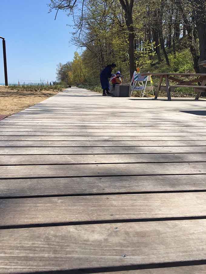 Wooden boardwalk leading to the beach, because nobody enjoys the awkward sand-in-your-car-for-three-months situation.
