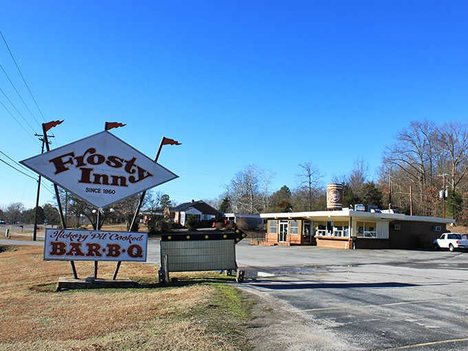 Frosty Inn's vintage sign beckons like a beacon of barbecue hope along the roadside since 1952.