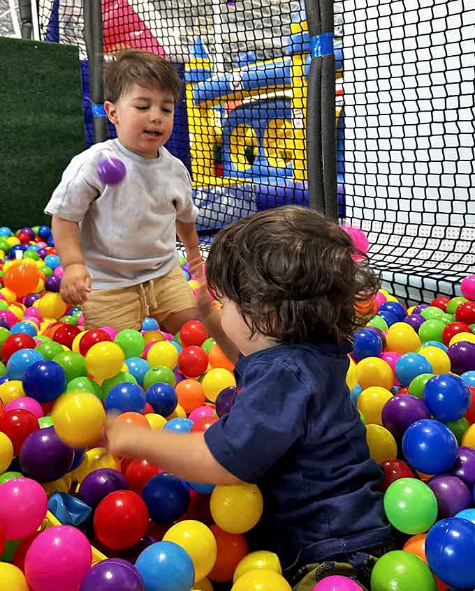 A ball pit so colorful it makes a bag of Skittles look monochromatic. Taste the rainbow? More like swim in it.