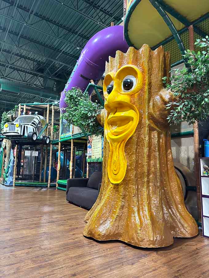 This golden tree character watches over the playground like a friendly sentinel from a particularly cheerful enchanted forest.