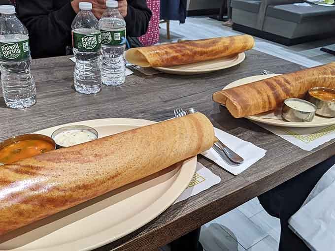 The masala dosa stretches across the table like it's showing off, and honestly, it has every right to be proud.