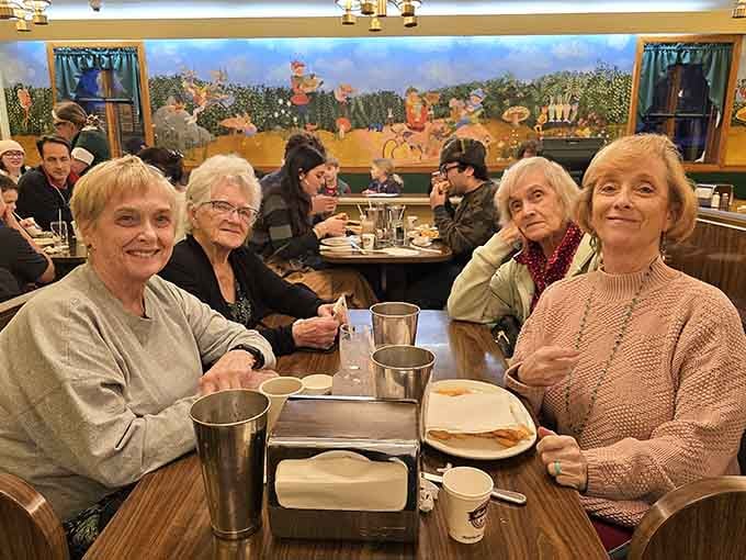 Multiple generations sharing a booth, proving some traditions are too delicious to ever let fade away completely.