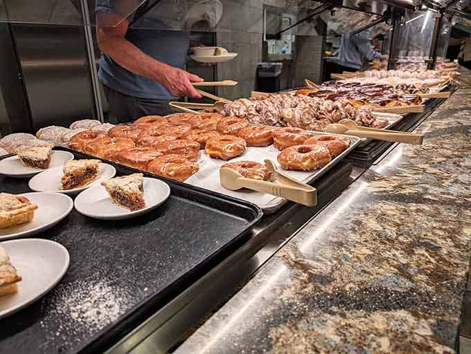 Fresh pastries lined up like sweet temptations, each one whispering "dessert first" directly into your willing soul.