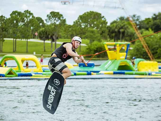 Cable wakeboarding in action, proving that being pulled across water on a board never gets old or easy.