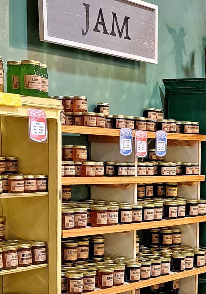 Homemade jams lining the shelves like edible rainbows, each jar packed with actual fruit and love.