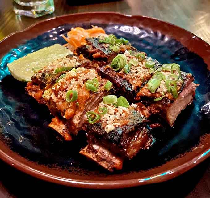 Ribs glazed to sticky perfection, making napkins less of a suggestion and more of an absolute requirement.